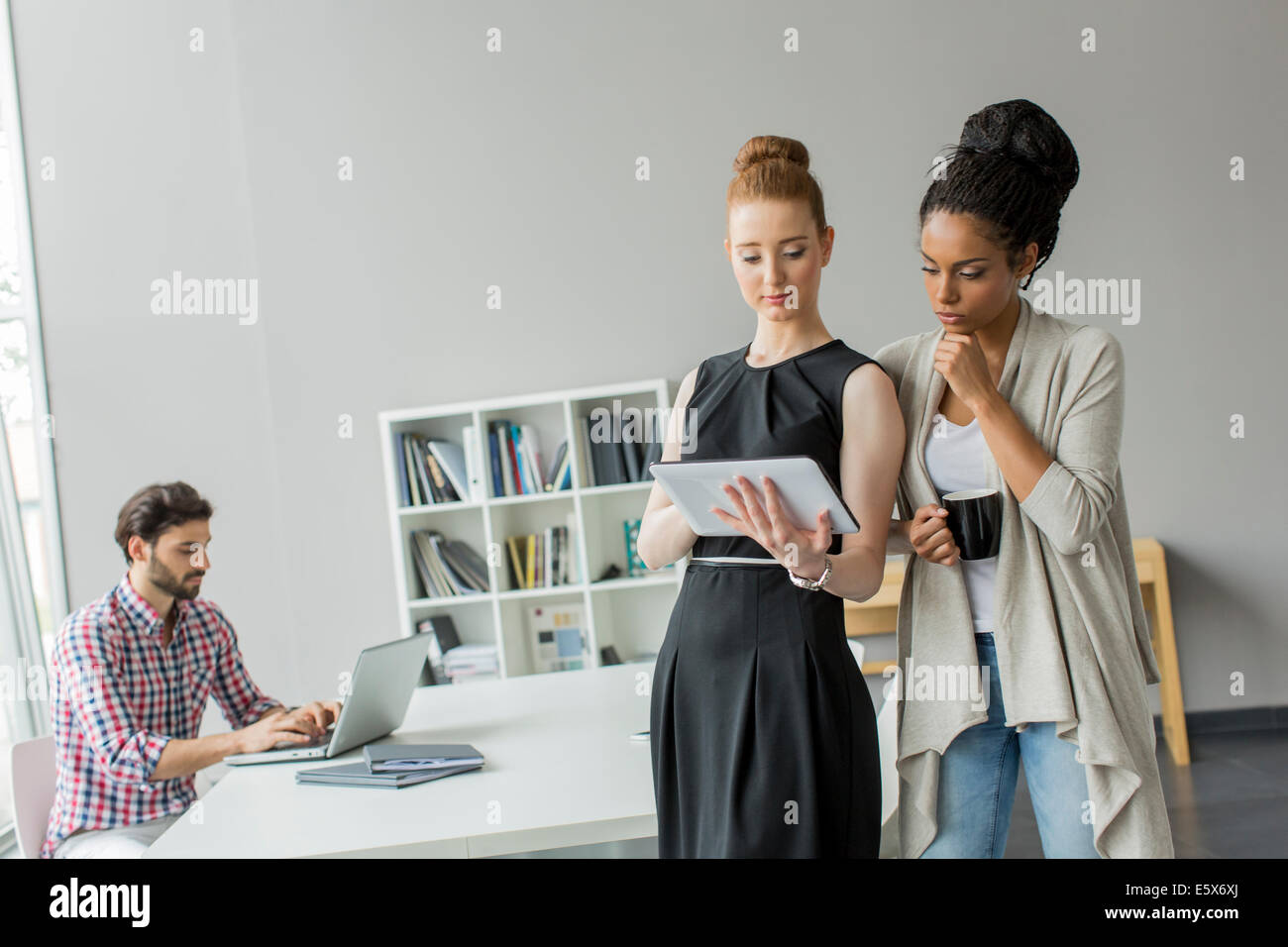 Young people in the office Stock Photo - Alamy
