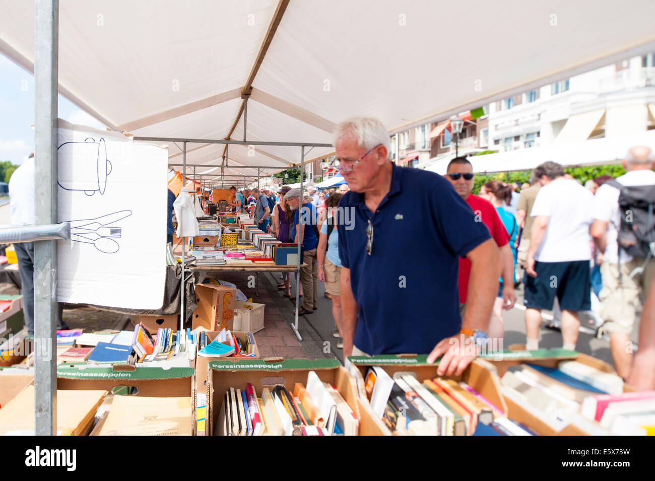 People shop at the Deventer book market in the Netherlands. Focal point ...