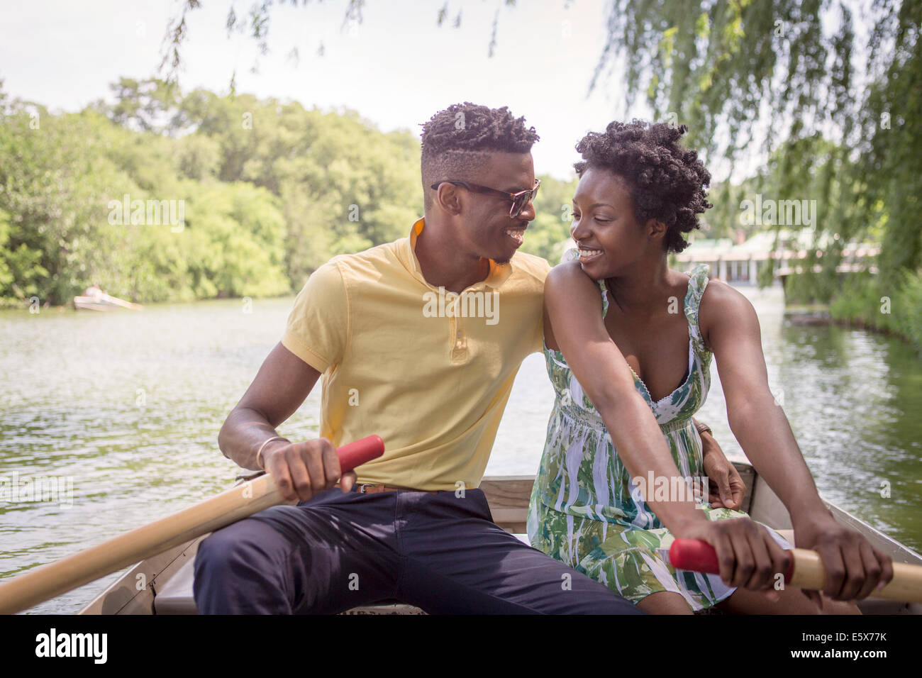 Young couple rowing on lake in Central Park, New York City, USA Stock ...
