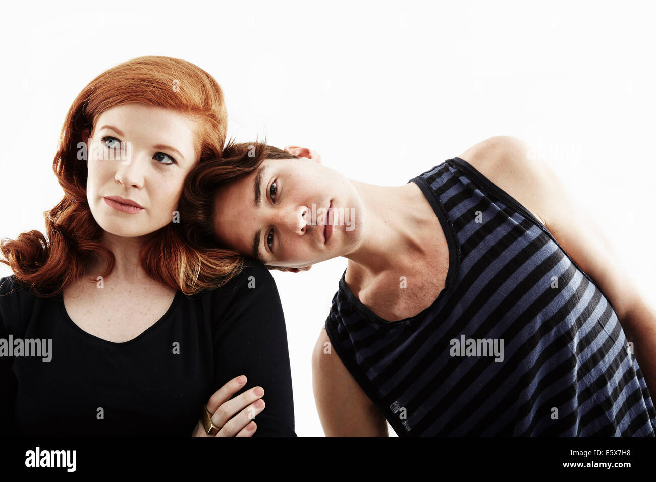 Studio portrait of young man leaning on young woman's shoulder Stock ...