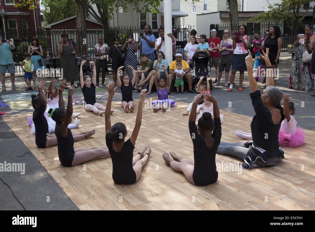 Young dancers from a local dance studio perform for the community at a ...