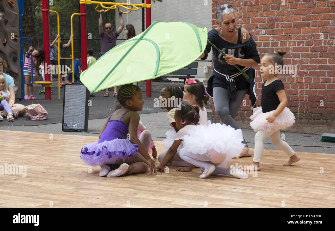 Young dancers from a local dance studio perform for the community at a ...