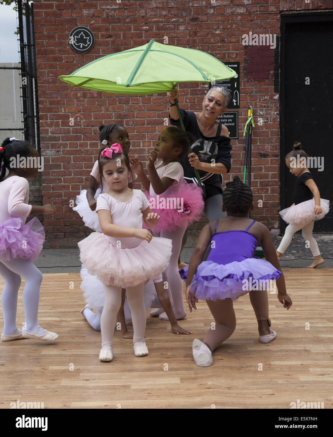 Young dancers from a local dance studio perform for the community at a ...
