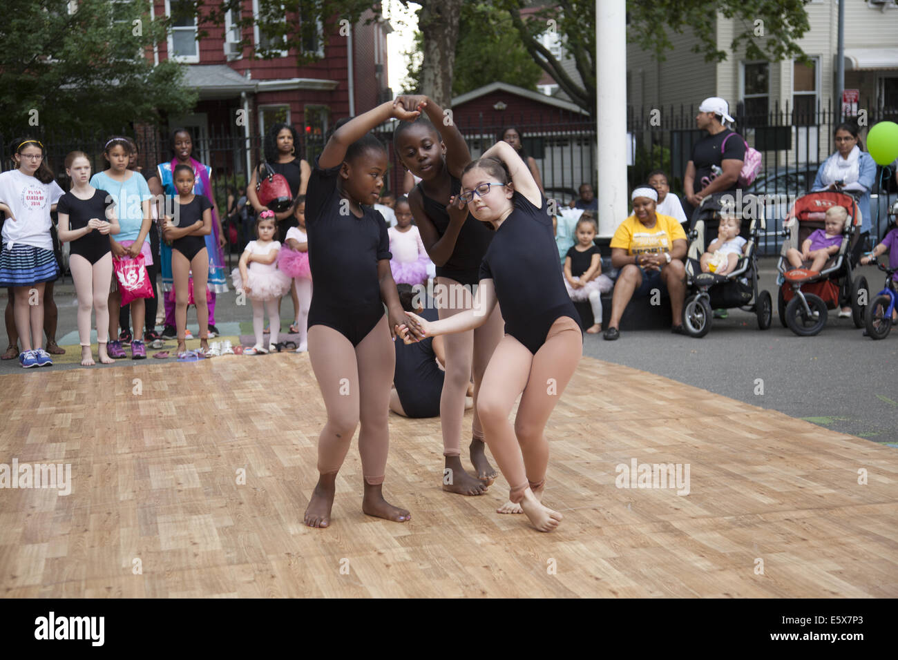Young dancers from a local dance studio perform for the community at a ...