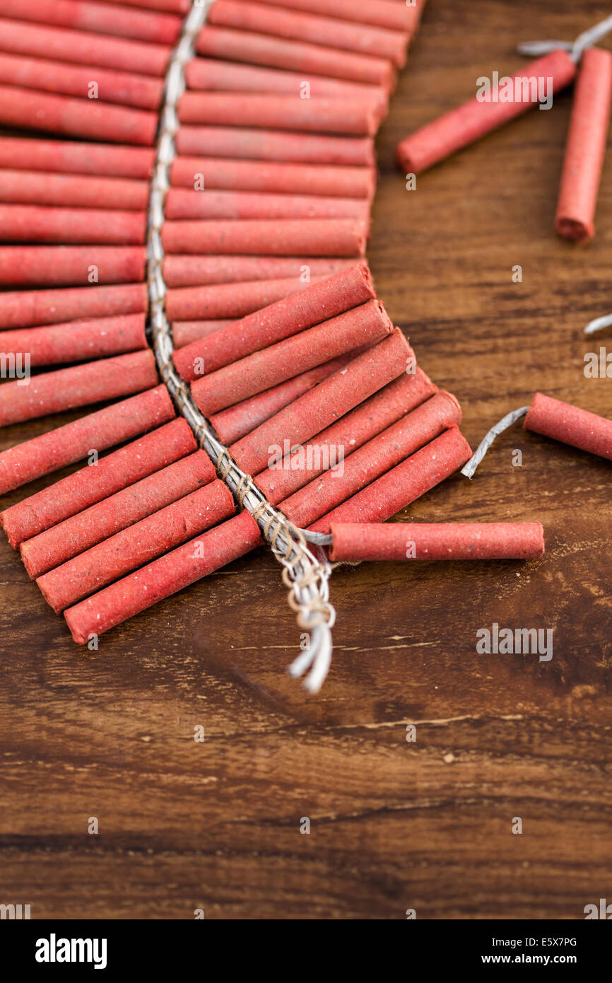 Roll of firecrackers on wood table Stock Photo - Alamy