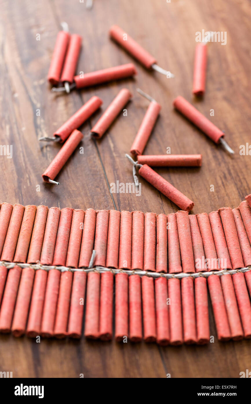 Roll of firecrackers on wood table Stock Photo - Alamy