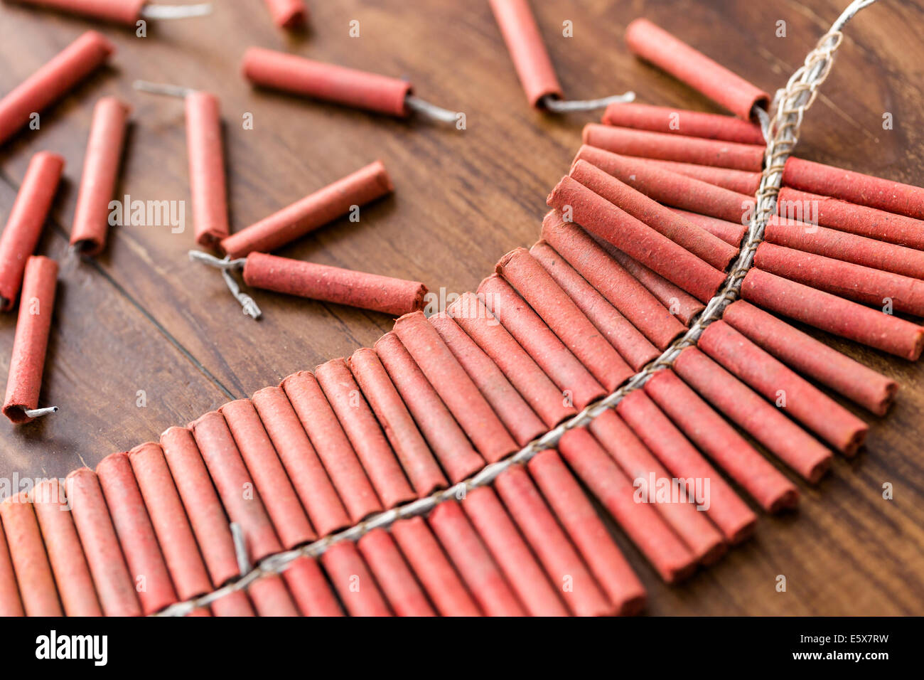 Roll of firecrackers on wood table Stock Photo - Alamy