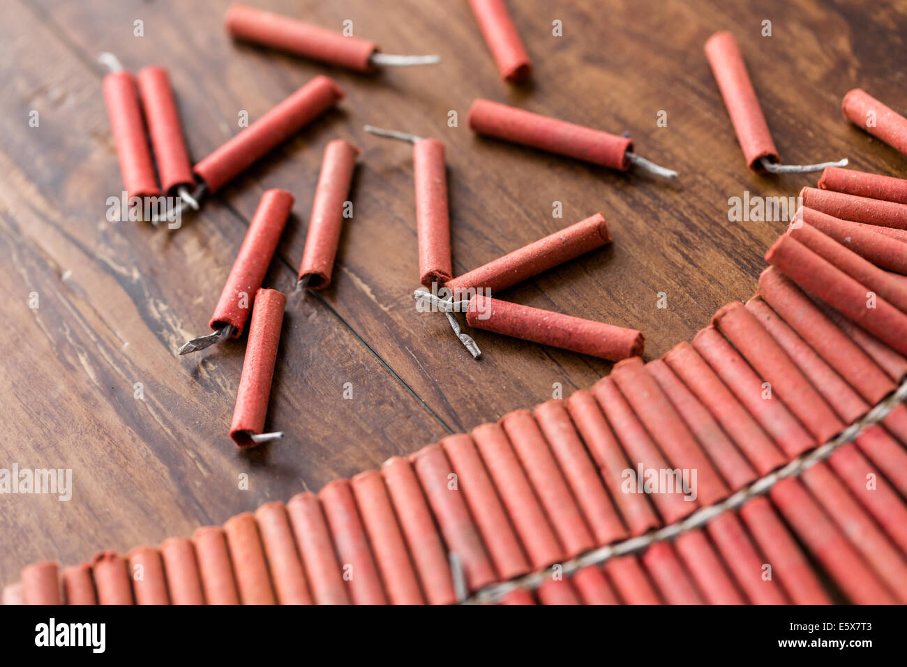 Roll of firecrackers on wood table Stock Photo - Alamy