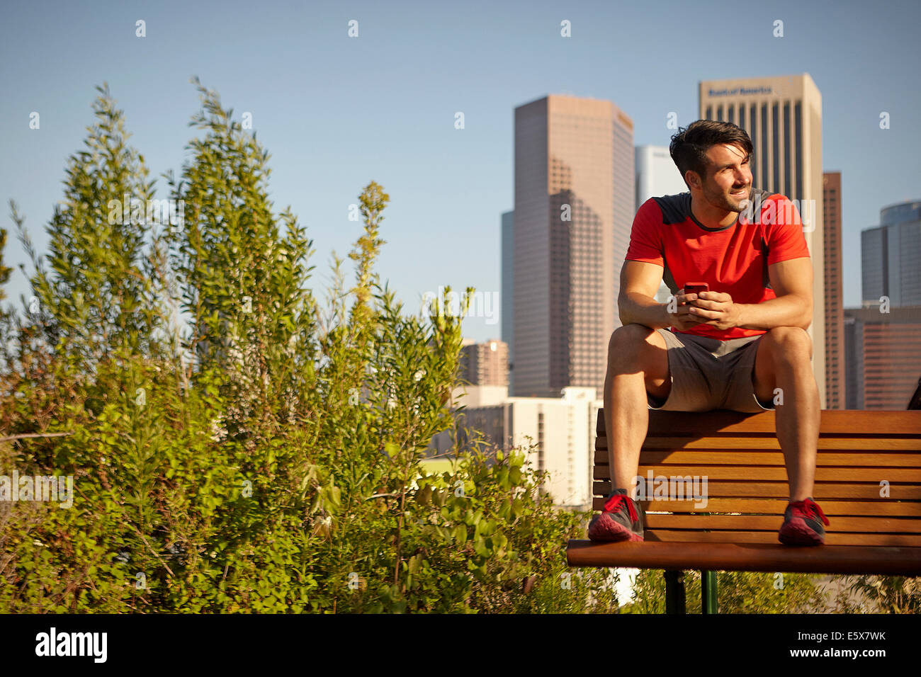 Taking a break by sitting on a park bench hi-res stock photography and ...