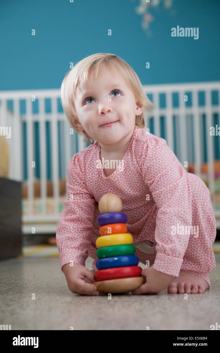 Female toddler playing with stacking toy Stock Photo - Alamy