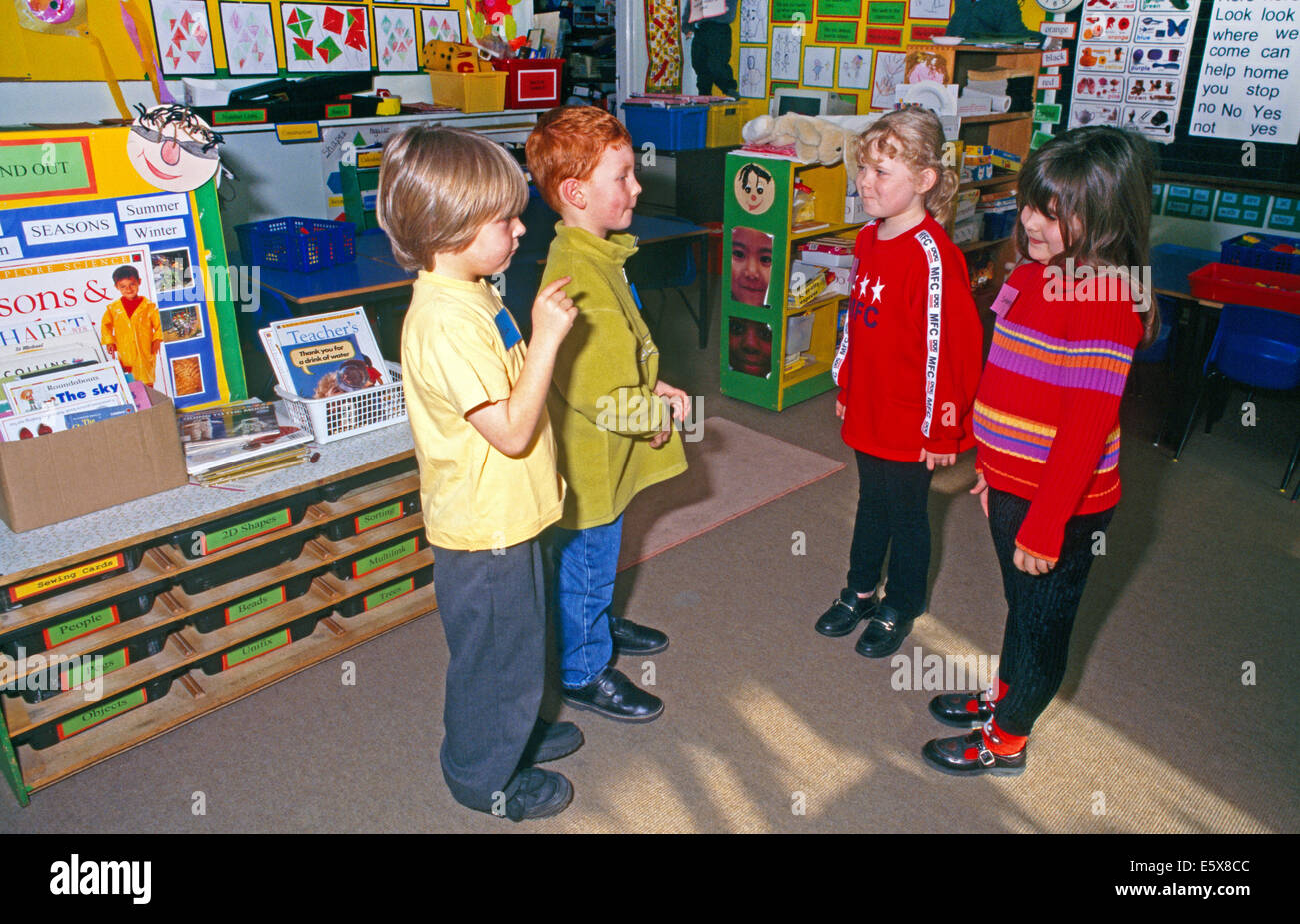 Two boys talking classroom hi-res stock photography and images - Alamy