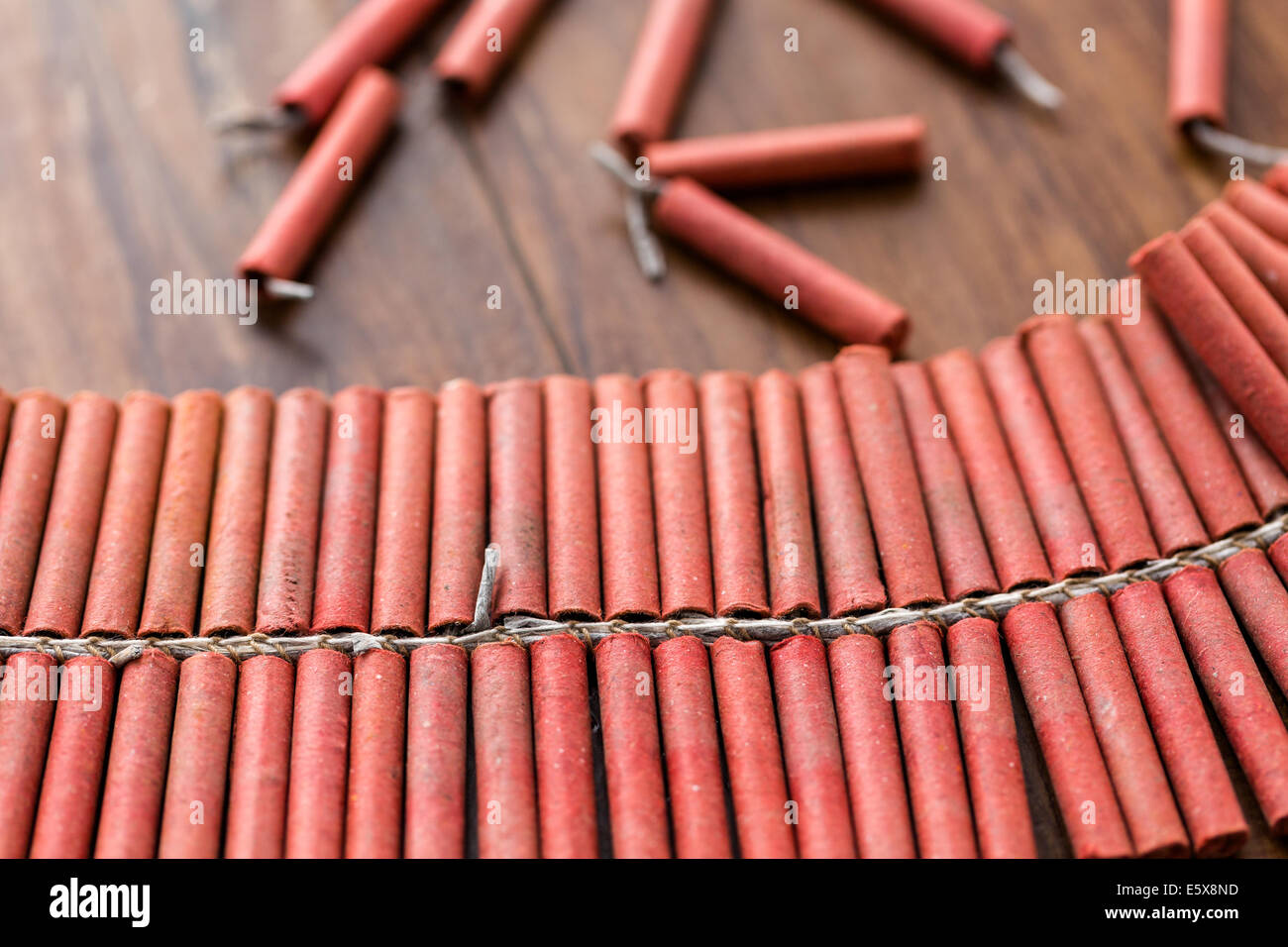 Roll of firecrackers on wood table Stock Photo - Alamy