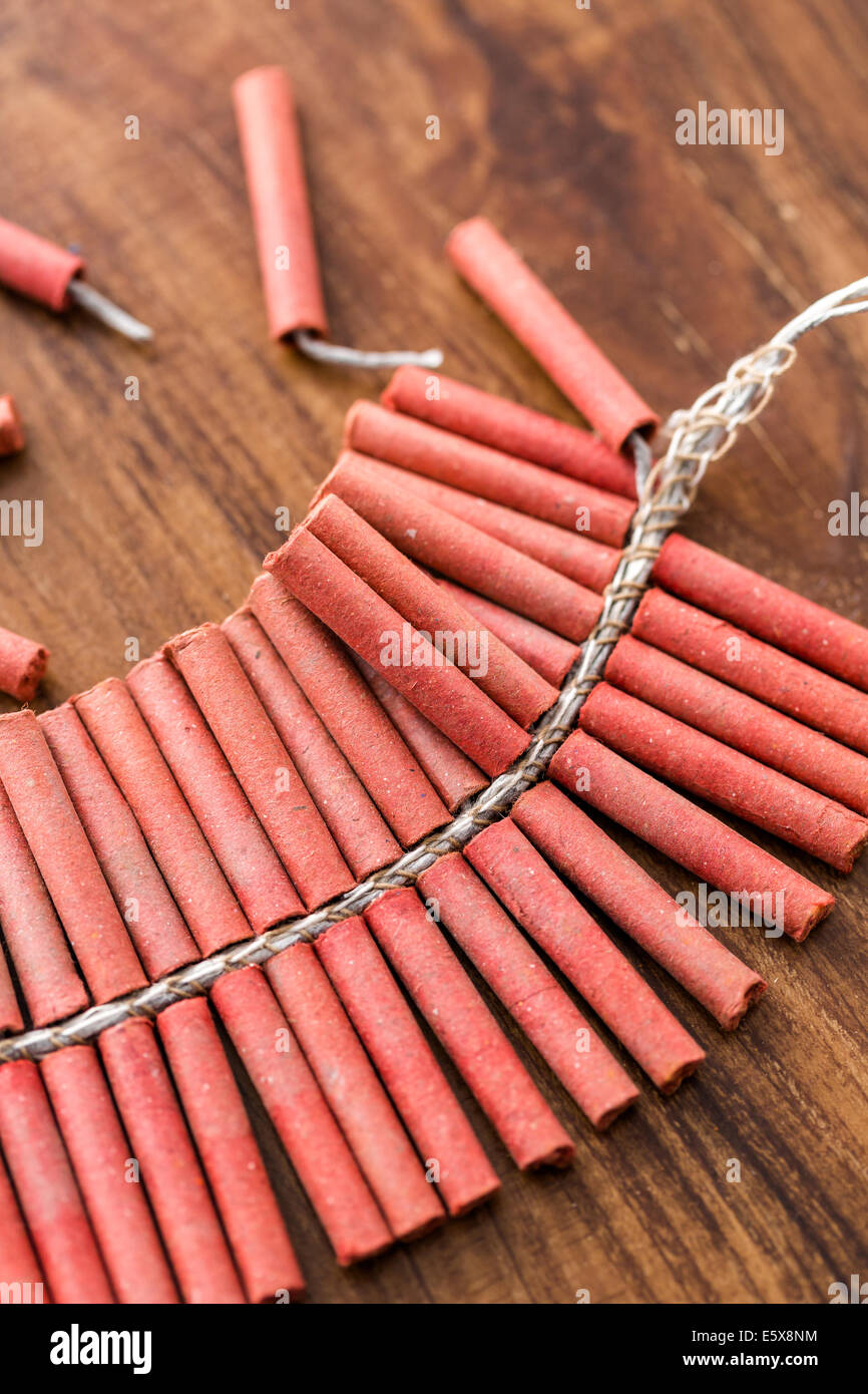 Roll of firecrackers on wood table Stock Photo - Alamy