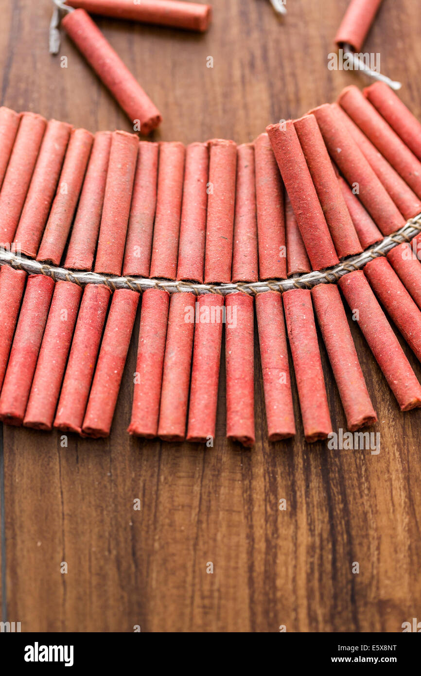 Roll of firecrackers on wood table Stock Photo - Alamy