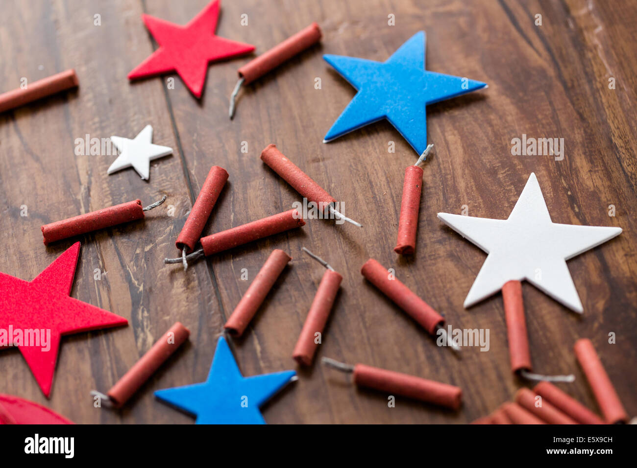Roll of firecrackers with red, white and blue stars on wood table Stock ...