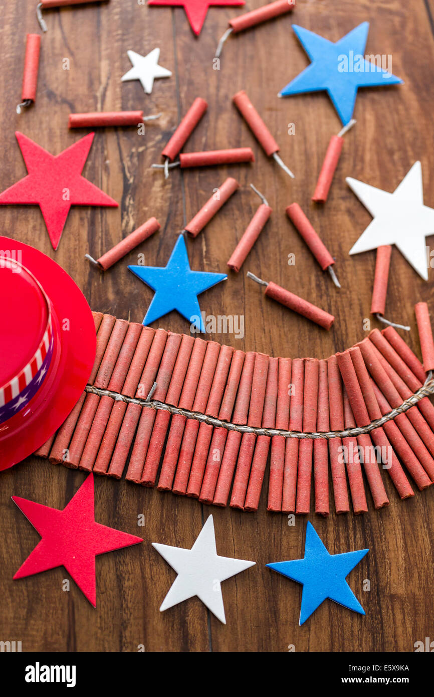 Roll of firecrackers with red, white and blue stars on wood table Stock ...