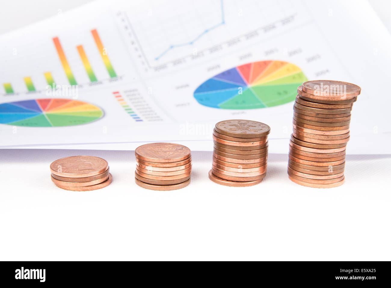 British pound coins and notes with financial chart Stock Photo - Alamy