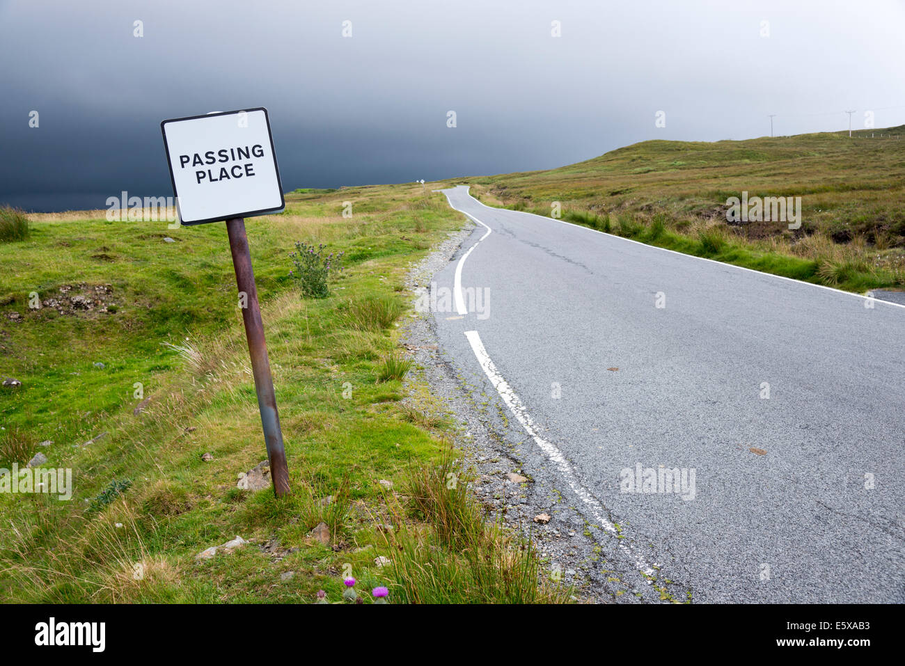 A passing place sign at the roadside on a single track road in the Isle ...