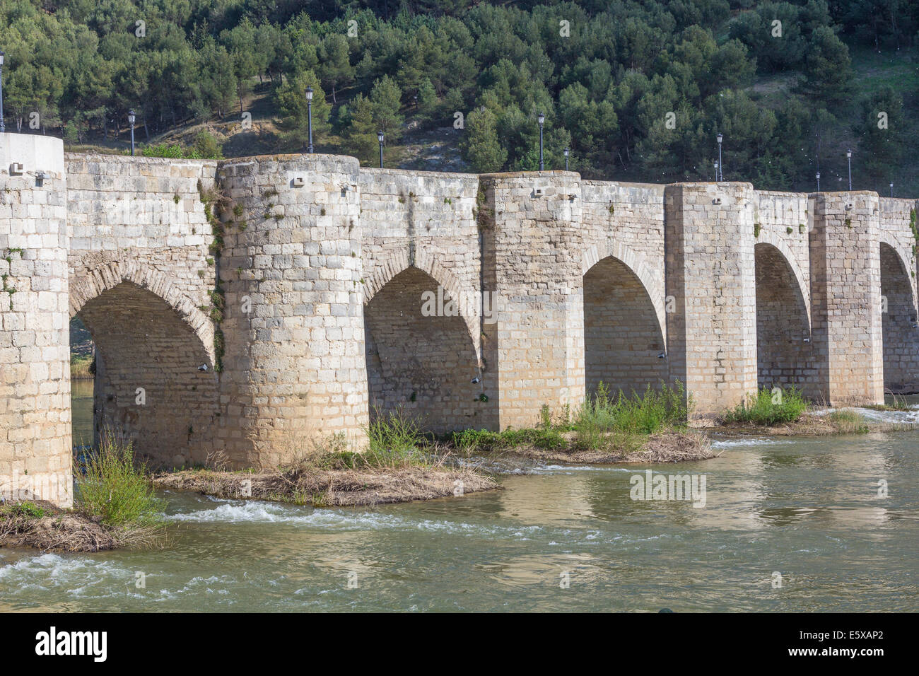 Old stone bridge block with arches and water Stock Photo - Alamy
