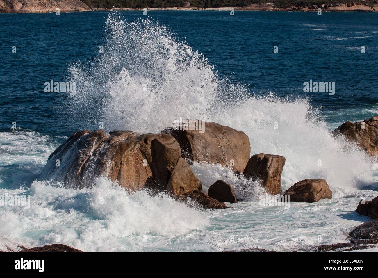 Surf On Rock Stock Photo - Alamy