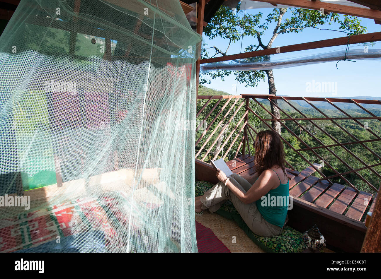 Woman reading in treehouse Goiás state Brazil Stock Photo - Alamy