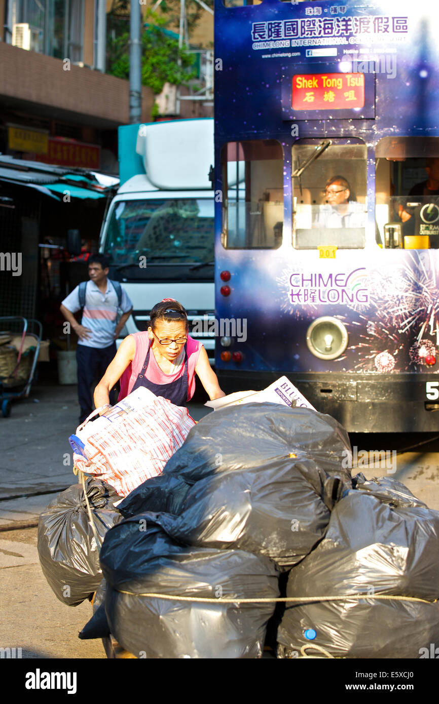 Pushing Heavy Load Of Trash. Street Cleaner Clearing Waste On Chun ...
