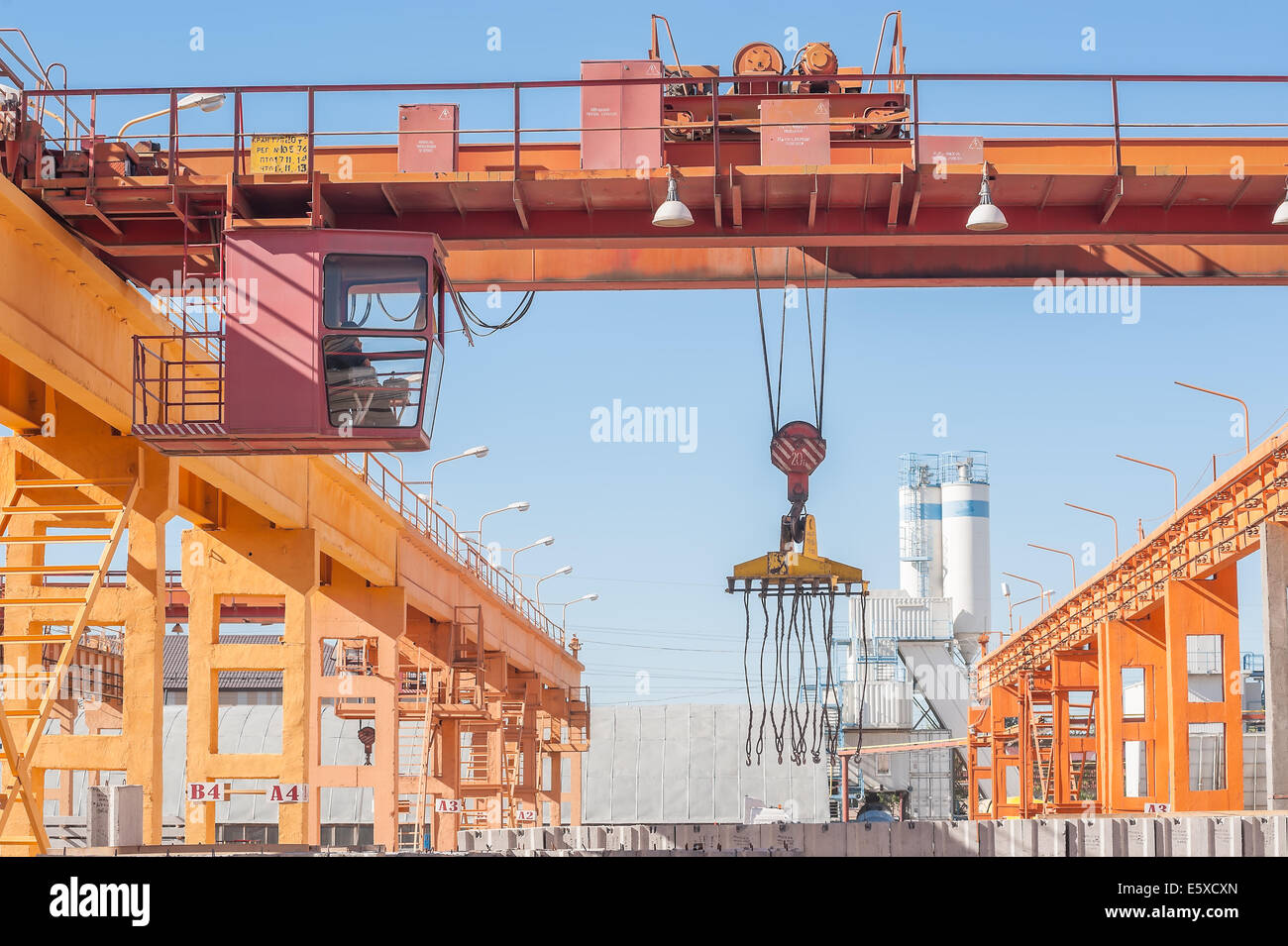 Crane operator working at finished goods warehouse Stock Photo - Alamy