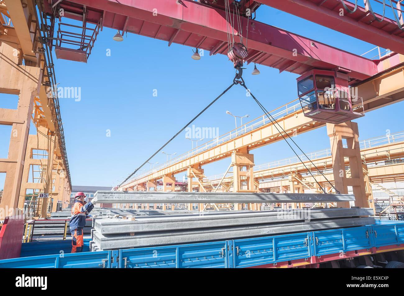 Loading concrete products in onboard car Stock Photo - Alamy
