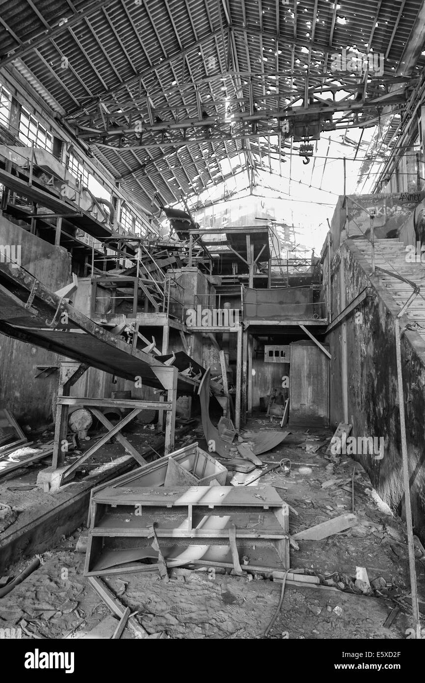 machinery destroyed in a coal mine abandoned after the war Stock Photo ...
