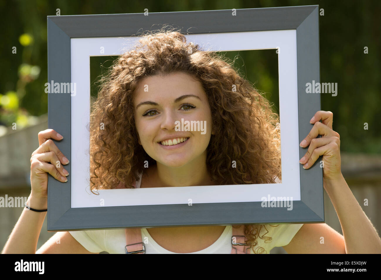 Portrait of teenage girl in a frame Stock Photo - Alamy