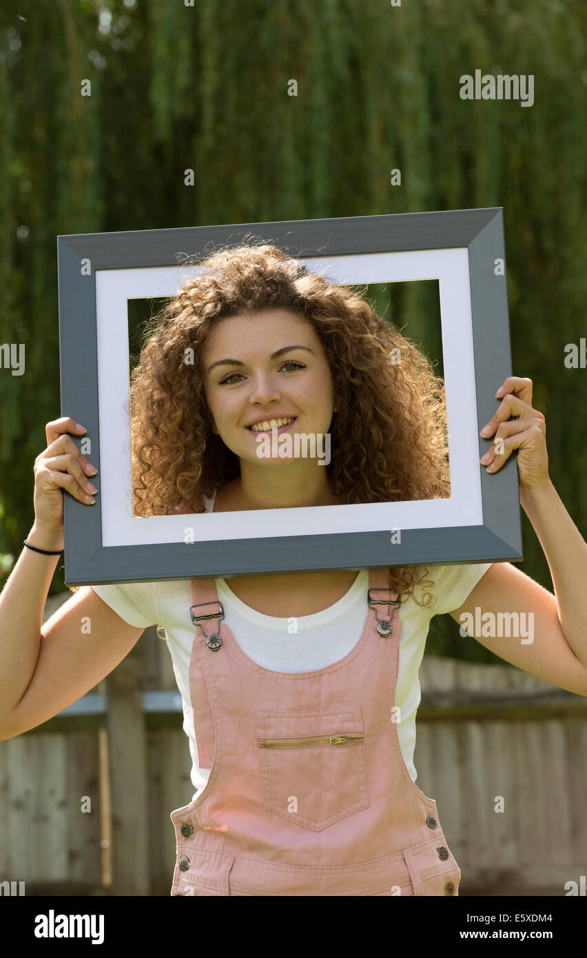 Portrait of teenage girl in a frame Stock Photo - Alamy