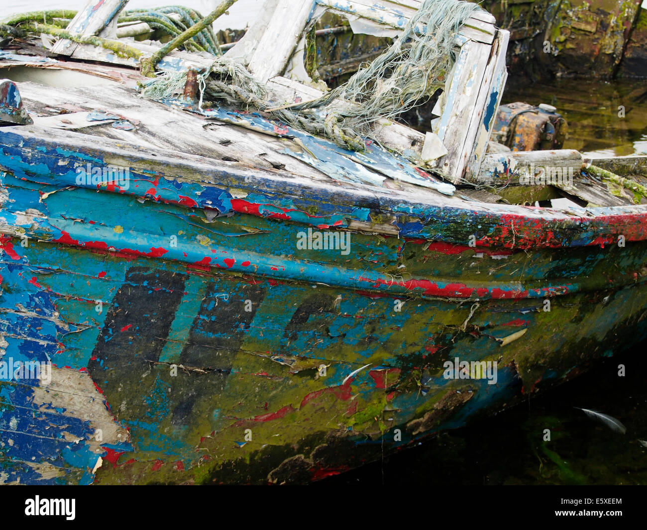 Abandoned fishing boats rotting in a quiet corner of the Claddagh basin ...