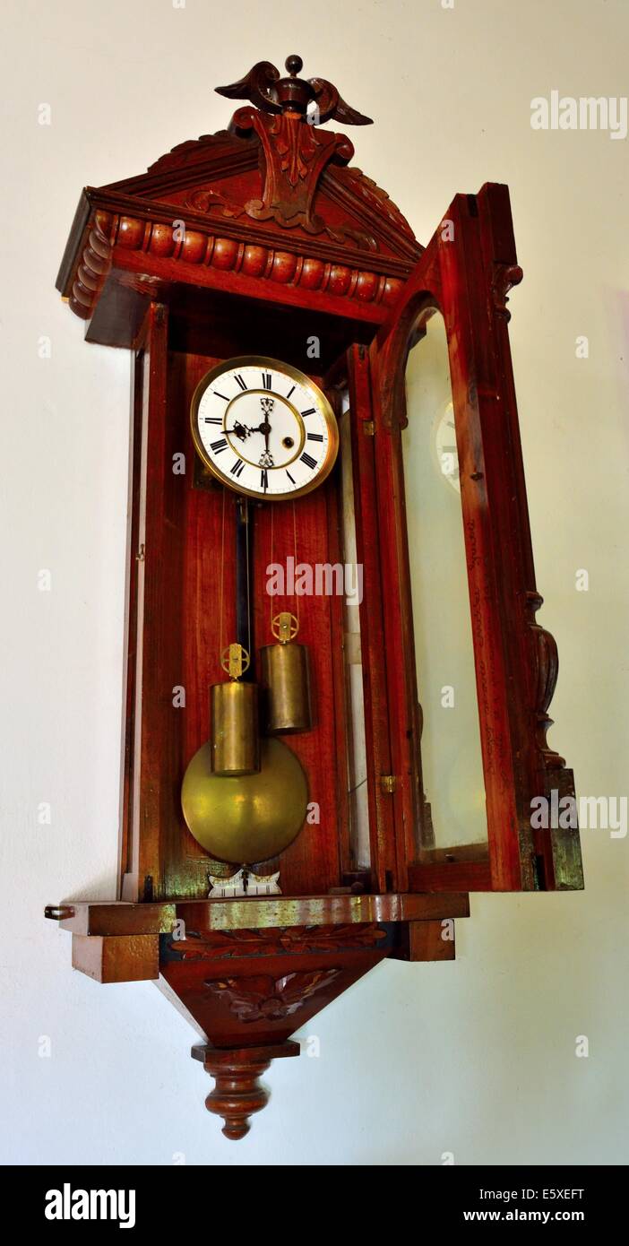 Antique manual wall clock Stock Photo - Alamy