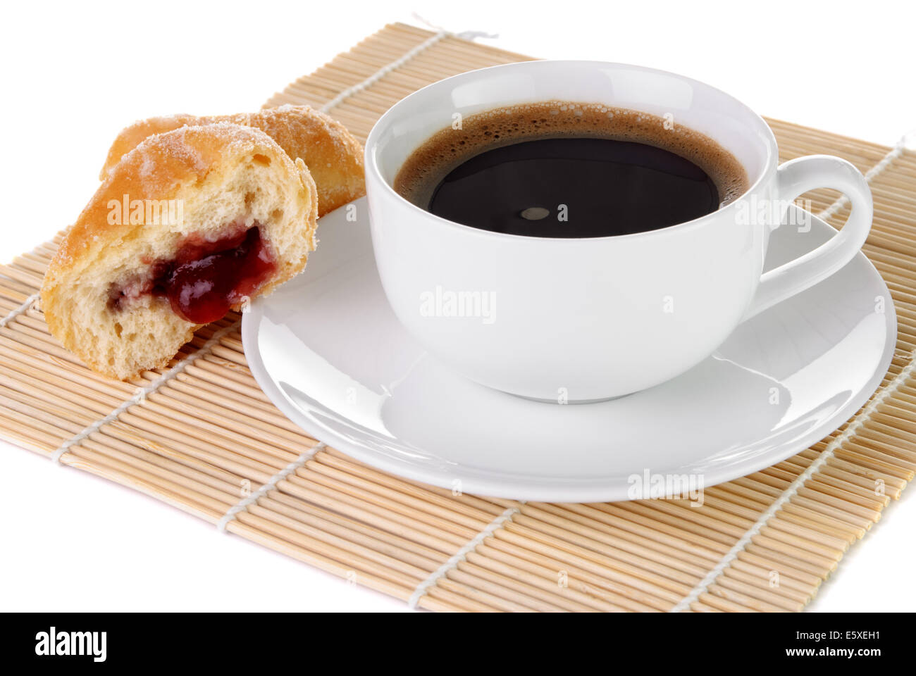 Cup of black coffee and a doughnut with strawberry jam Stock Photo - Alamy