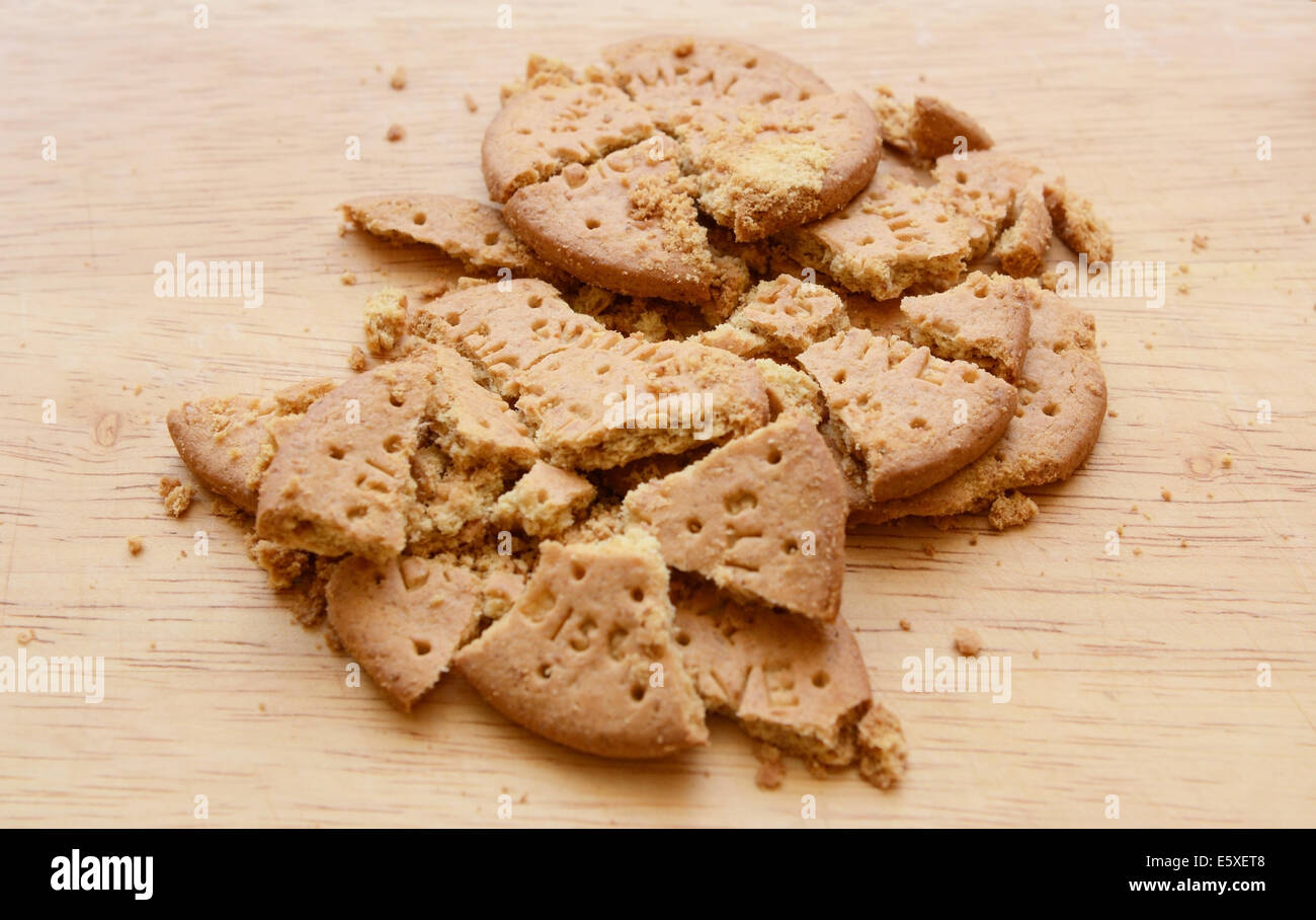 Pile of crushed digestive biscuits and crumbs on a wooden board Stock ...