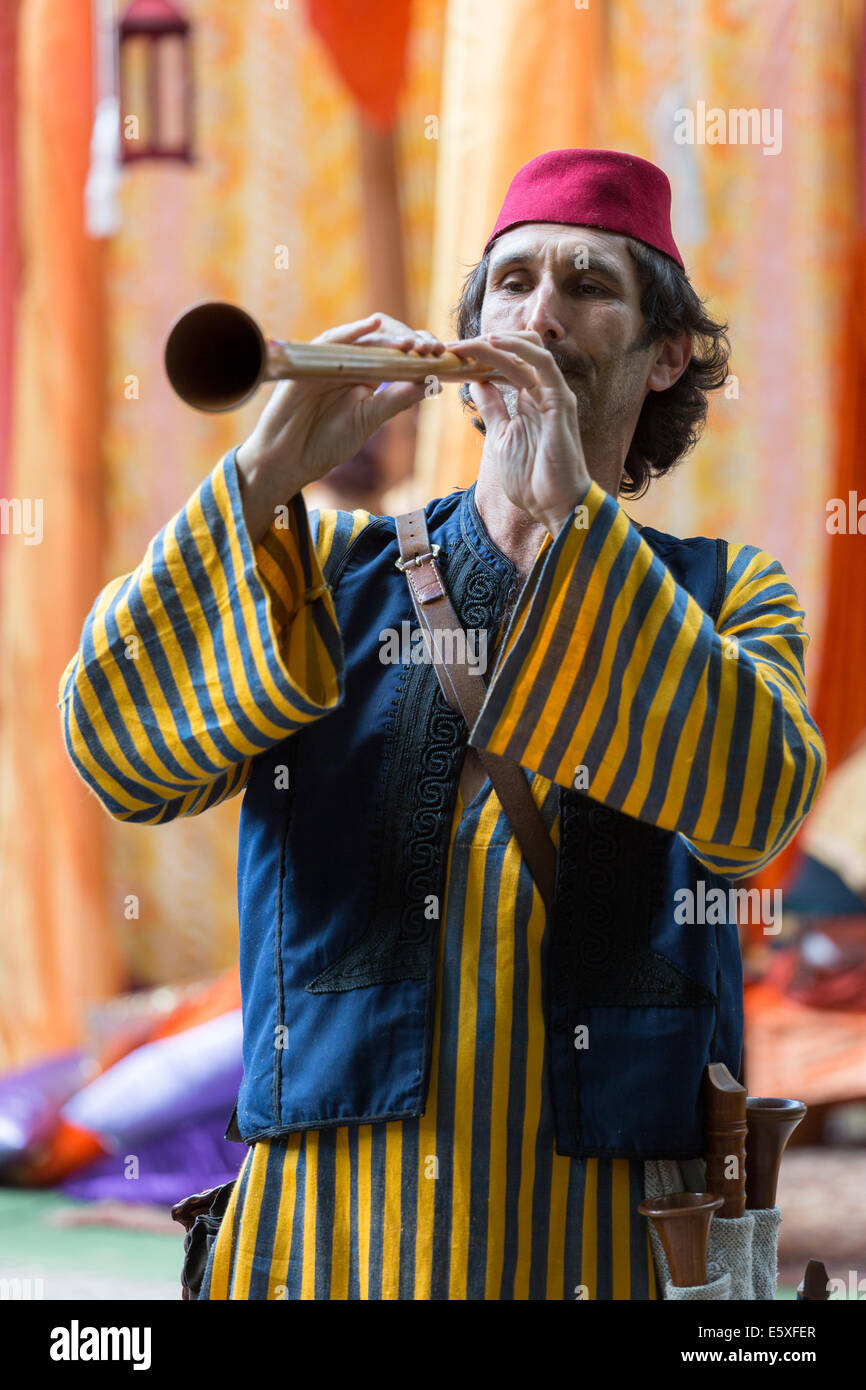 An Arabian musician plays the pipes at a festival Stock Photo - Alamy