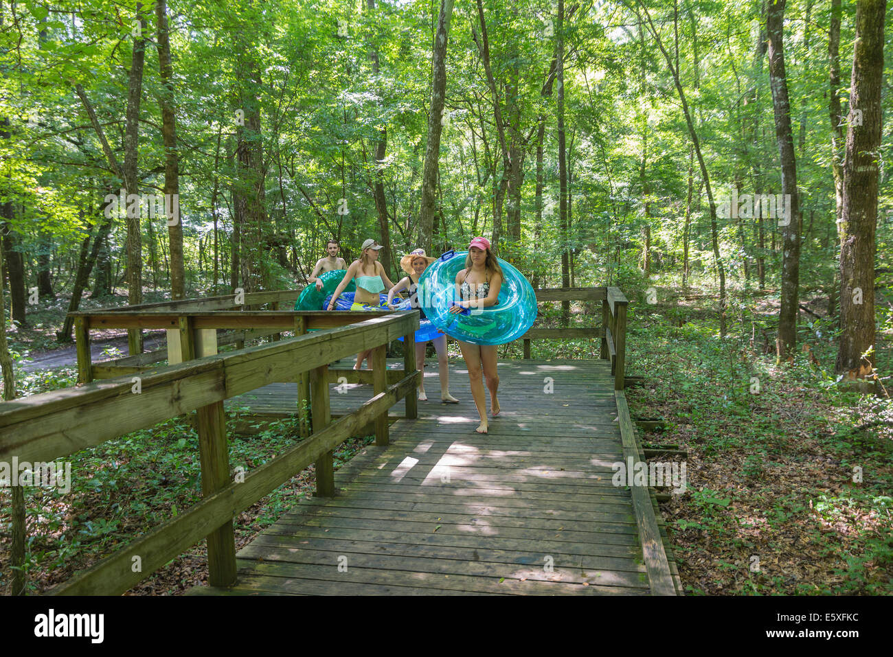 People walking down to one of the starting points for tubing down the ...