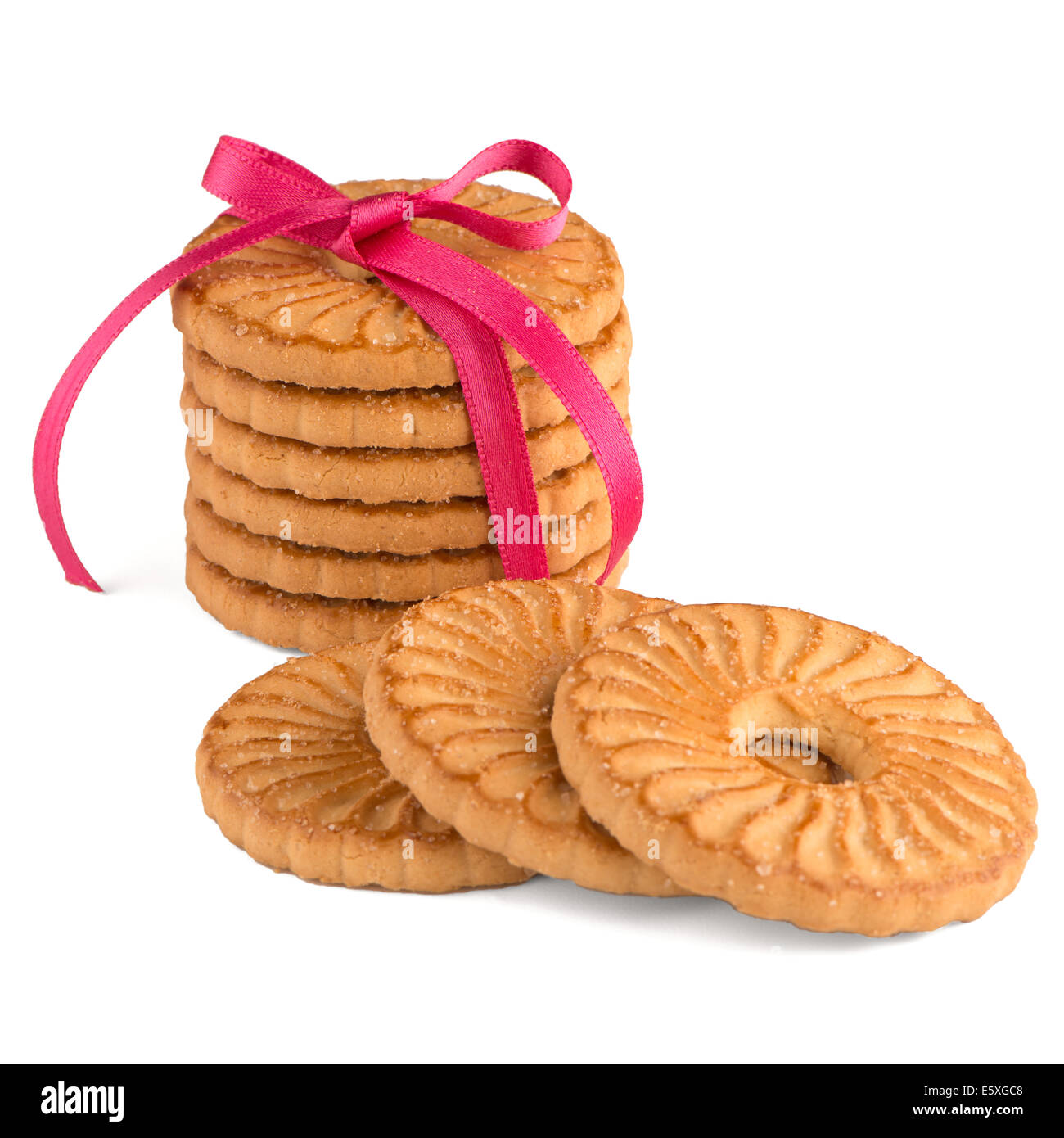 Festive wrapped rings biscuits pile isolated on a white background ...