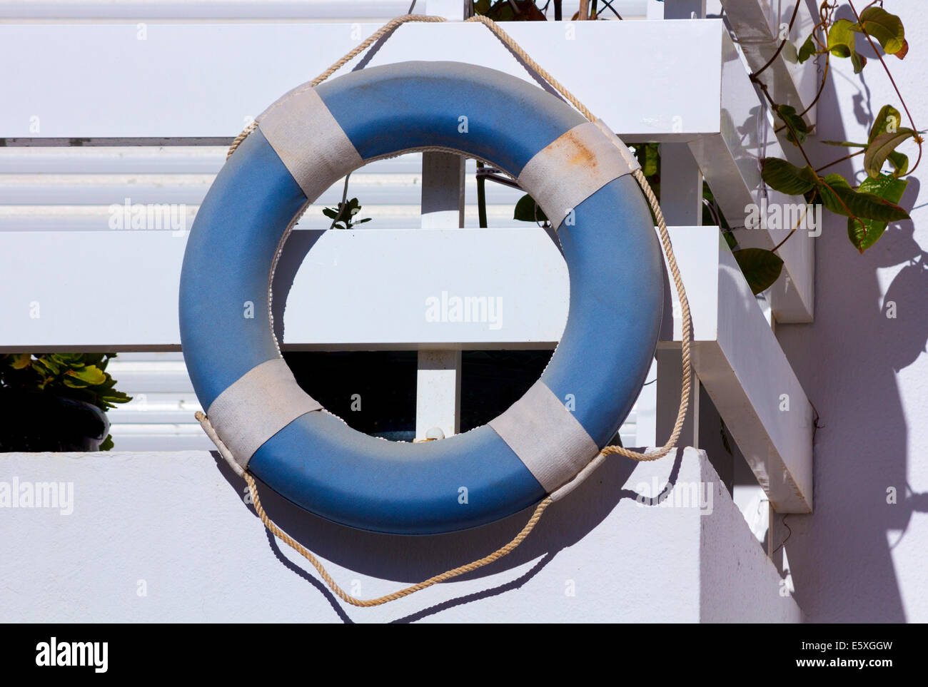 old blue and white lifesaver float Stock Photo - Alamy
