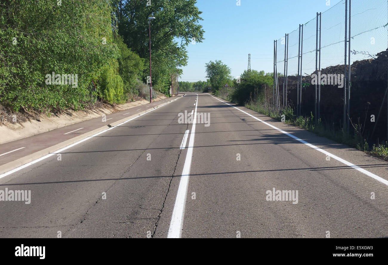 road perspective, with separate bike path Stock Photo - Alamy