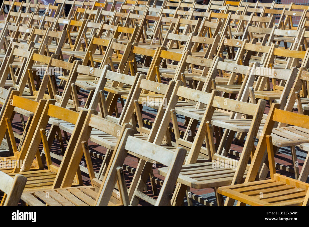 background with many wooden chairs lined Stock Photo - Alamy
