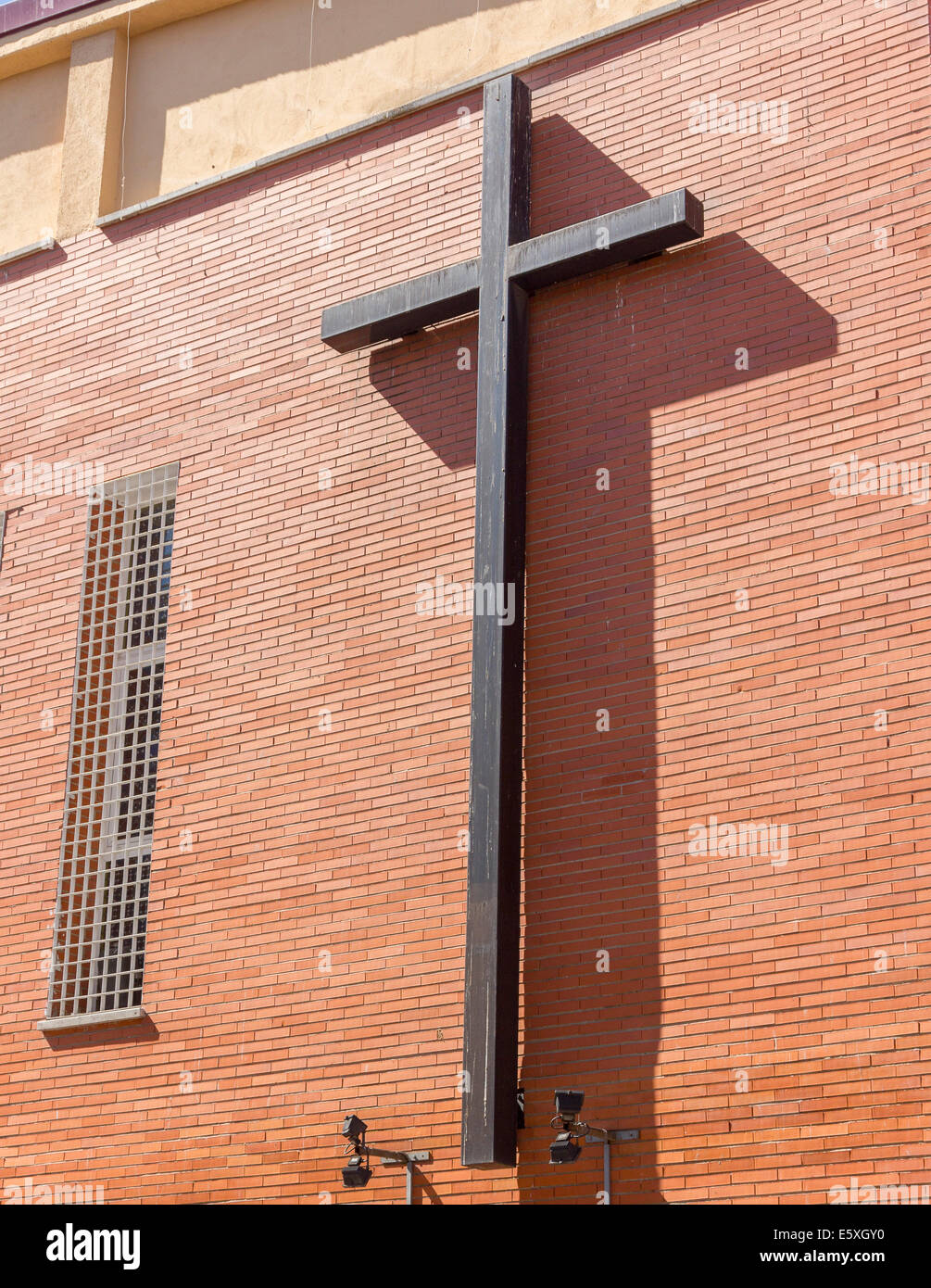 large iron cross on the facade of a Catholic church Stock Photo - Alamy