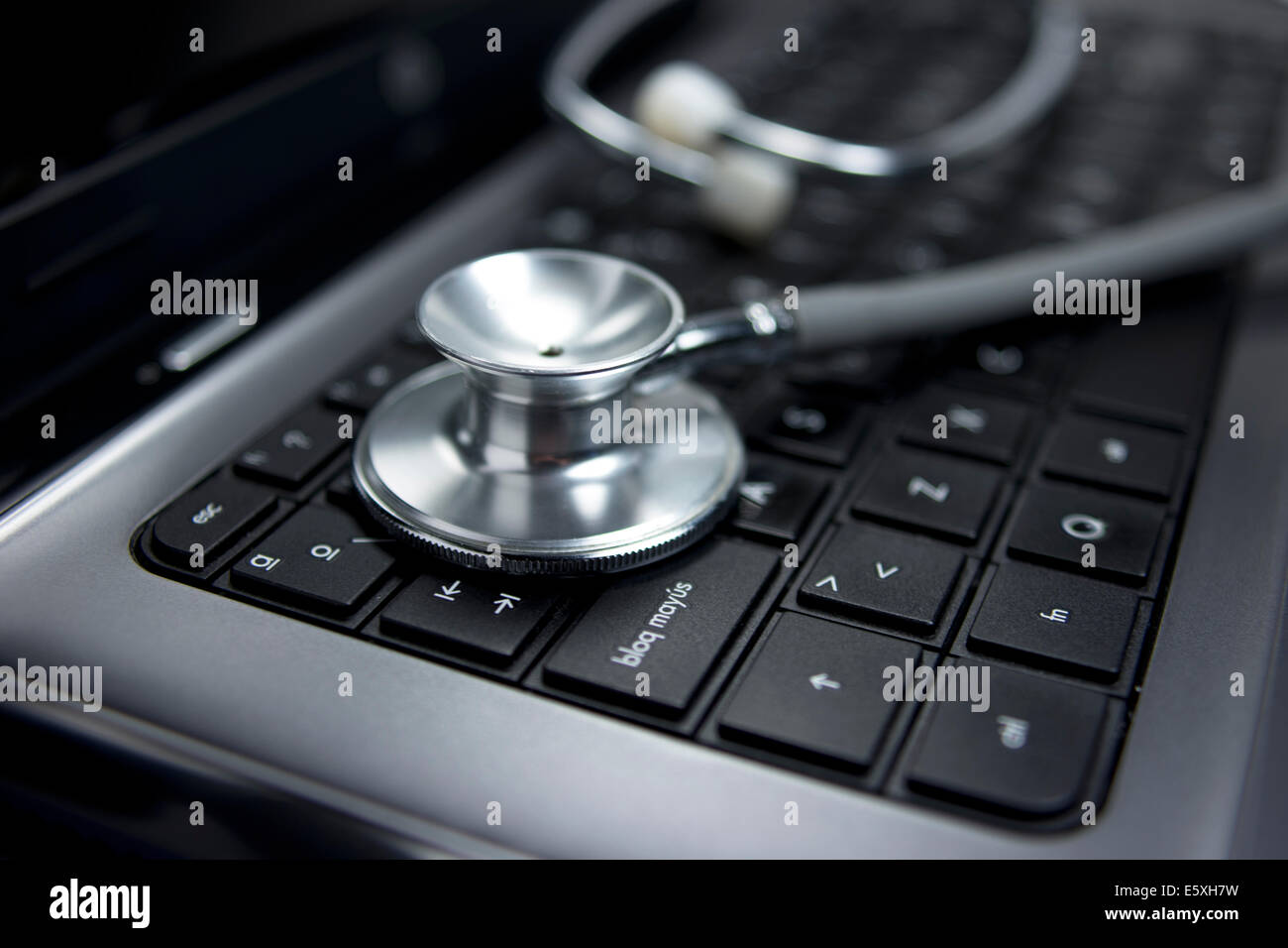 Close-up of stethoscope on computer keyboard Stock Photo - Alamy