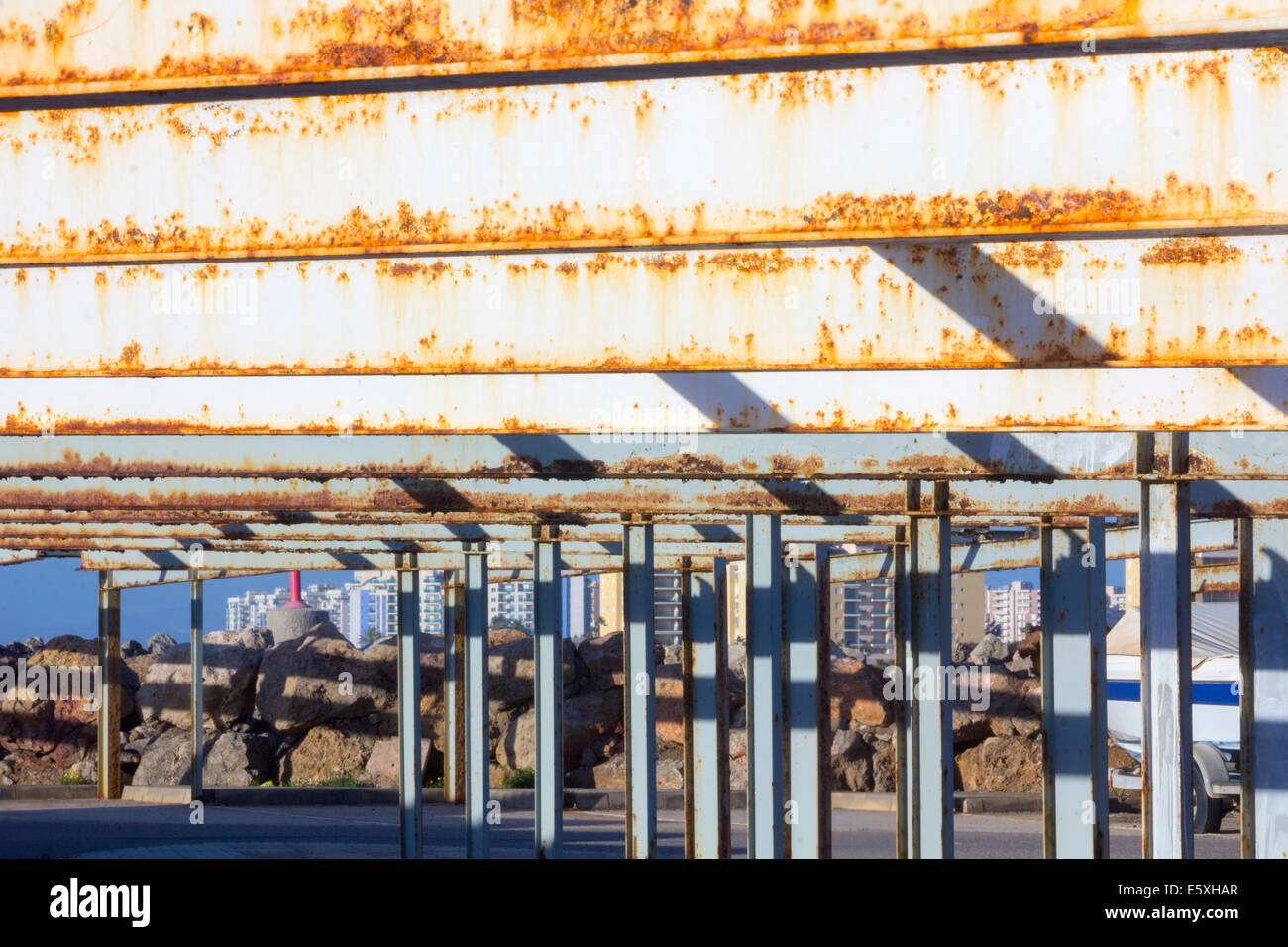old rusty iron frame for a abandoned parking Stock Photo - Alamy