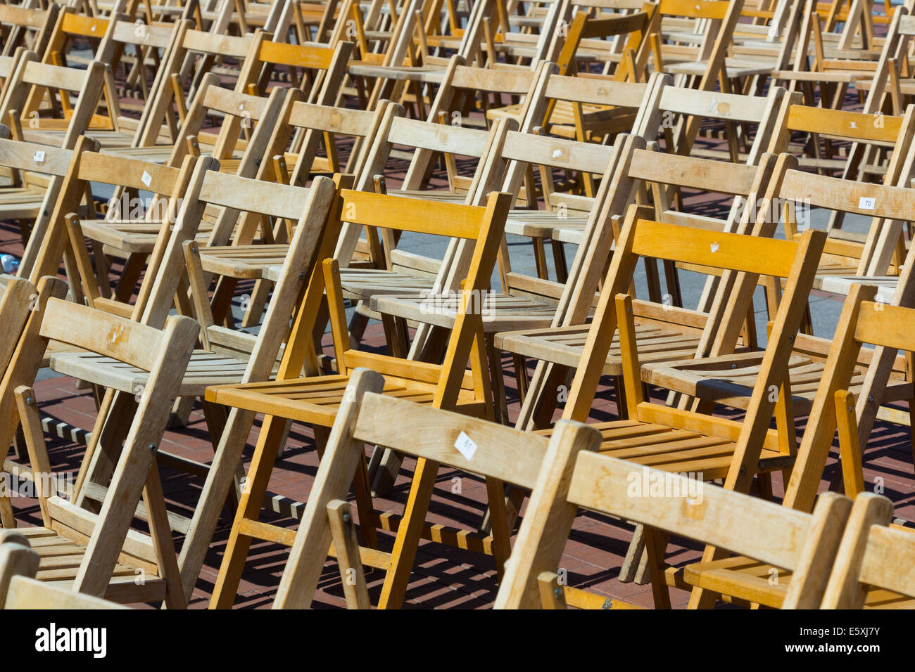 background with many wooden chairs lined Stock Photo - Alamy
