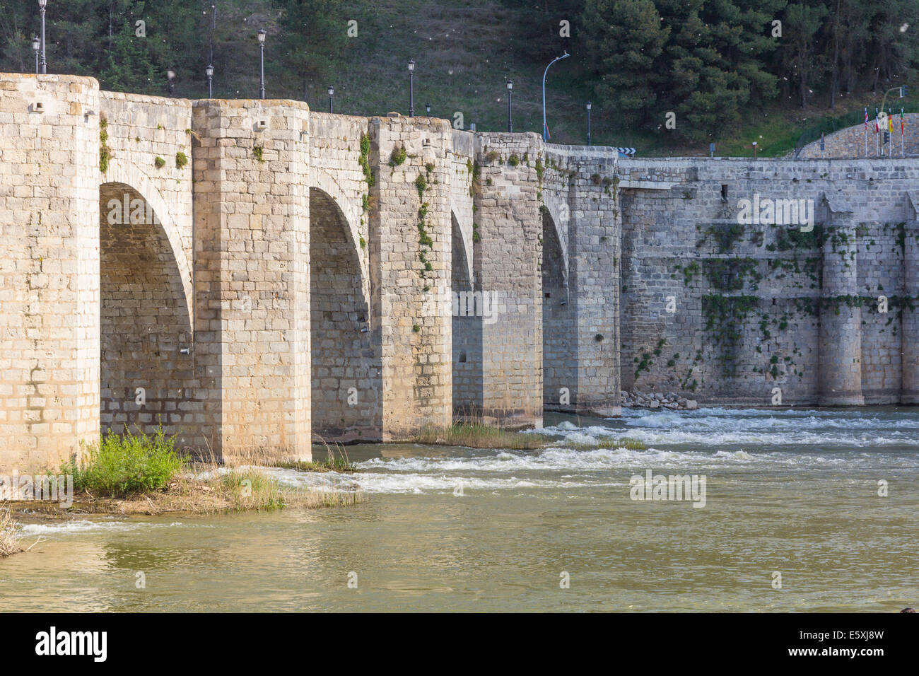 Old stone bridge block with arches and water Stock Photo - Alamy