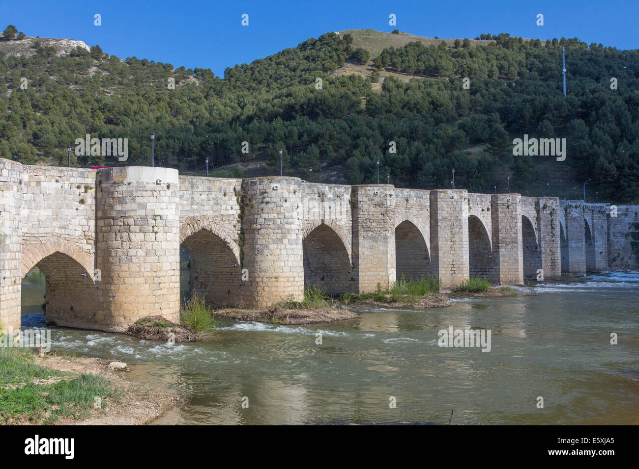 Old stone bridge block with arches and water Stock Photo - Alamy