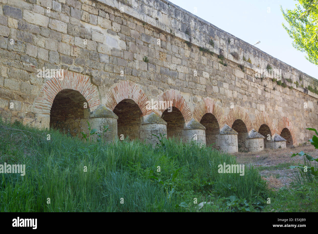 Old stone bridge block with arches and water Stock Photo - Alamy
