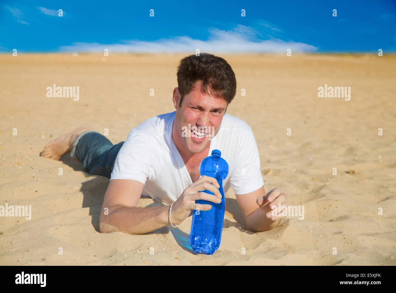 Caucasian man happy to find water in desert Stock Photo - Alamy