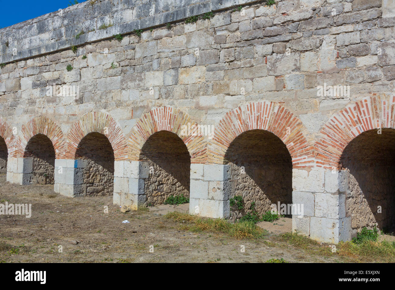 Old stone bridge block with arches and water Stock Photo - Alamy
